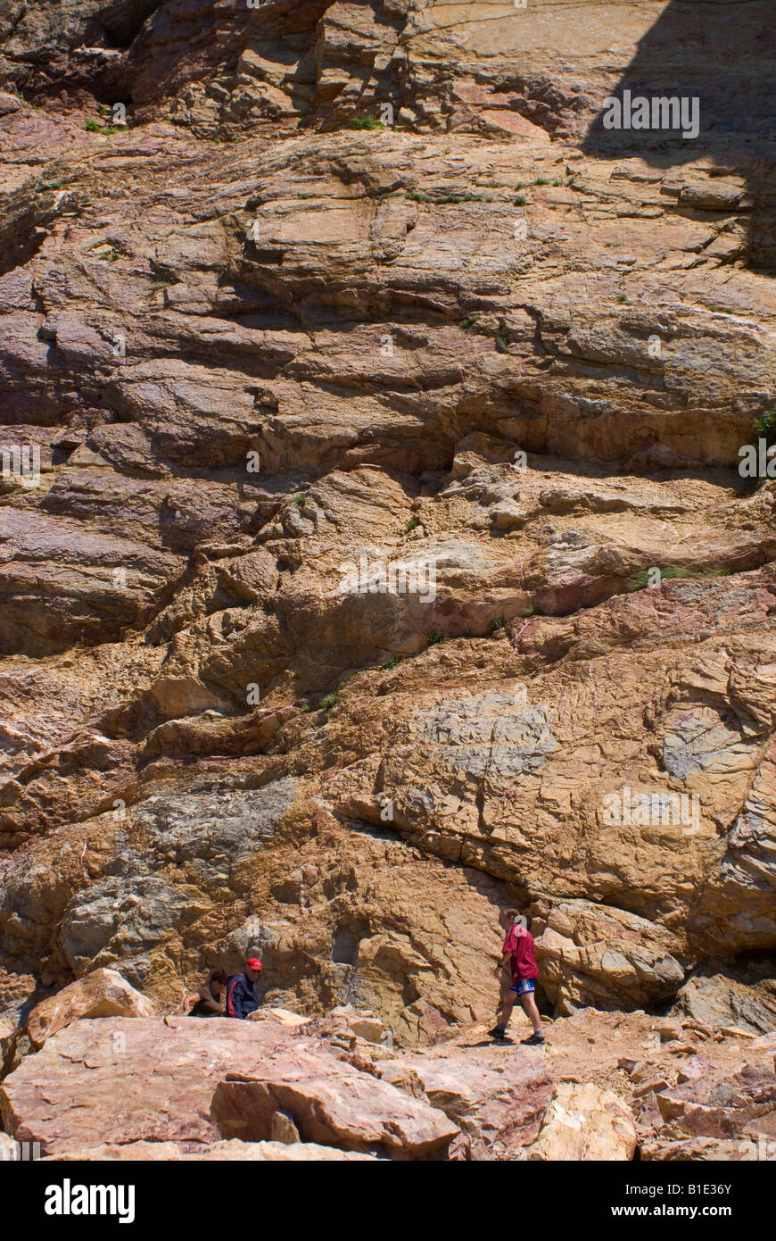 Perce rock walkers low tide Quebec Canada Stock Photo - Alamy