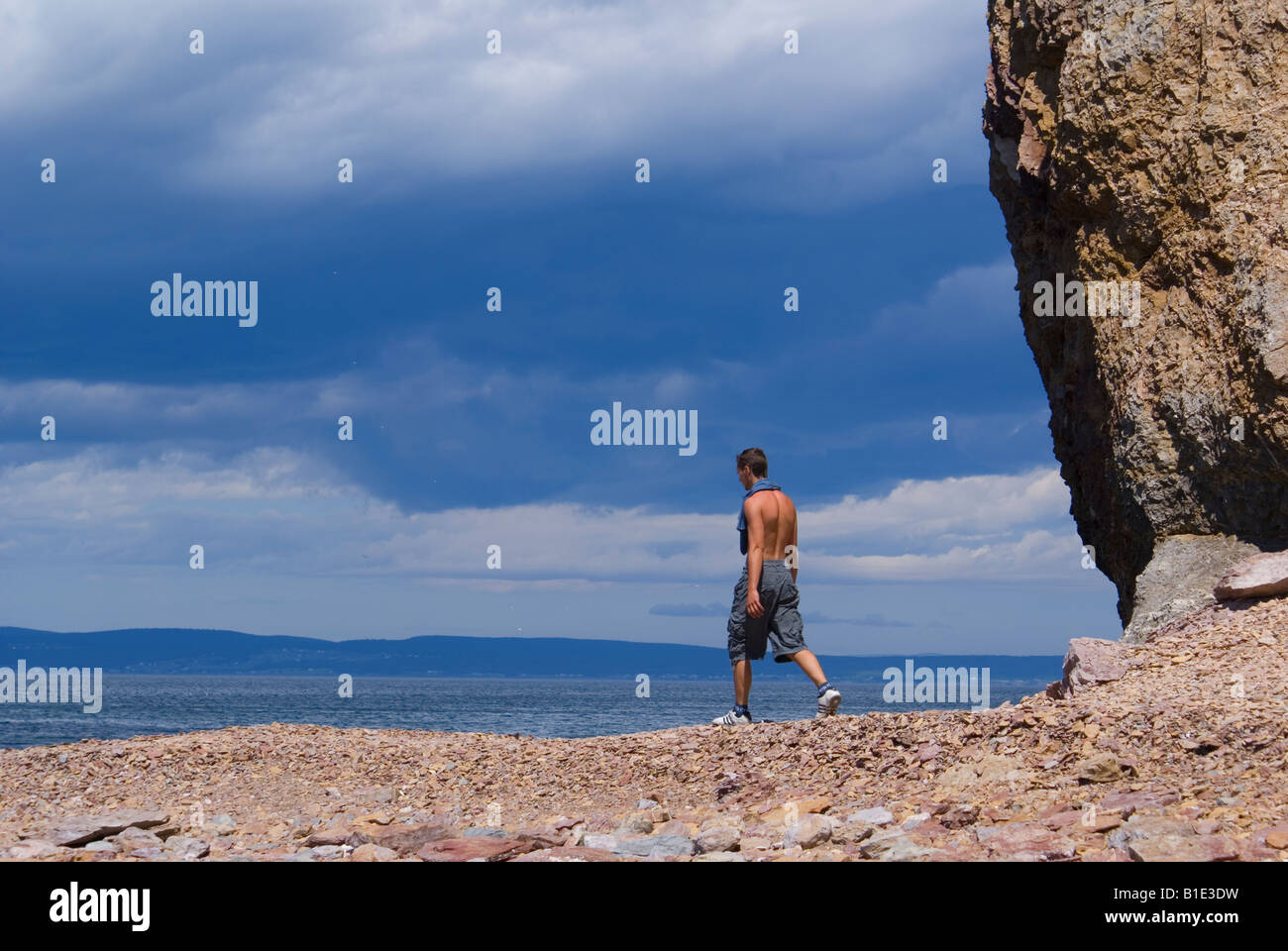Perce rock walker Quebec Canada Stock Photo - Alamy