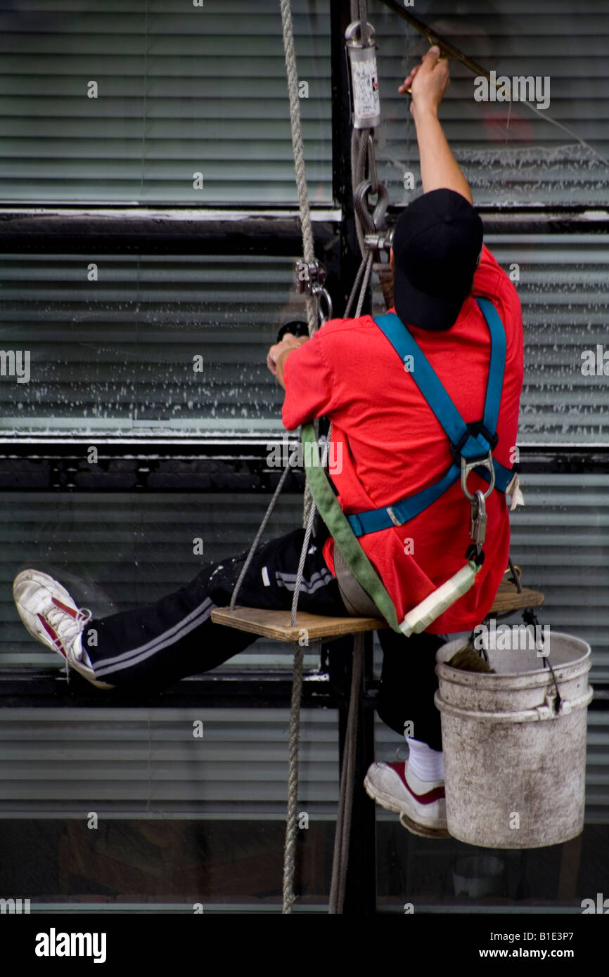 Male worker hanging from a rope hi-res stock photography and images - Alamy