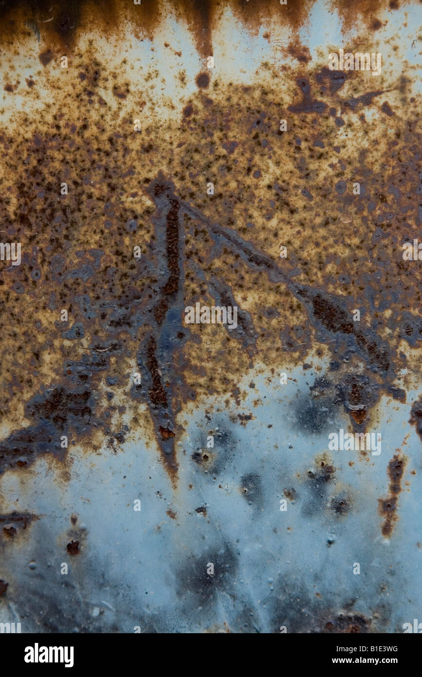 Scratch marks on blue metallic background with rust from age showing ...