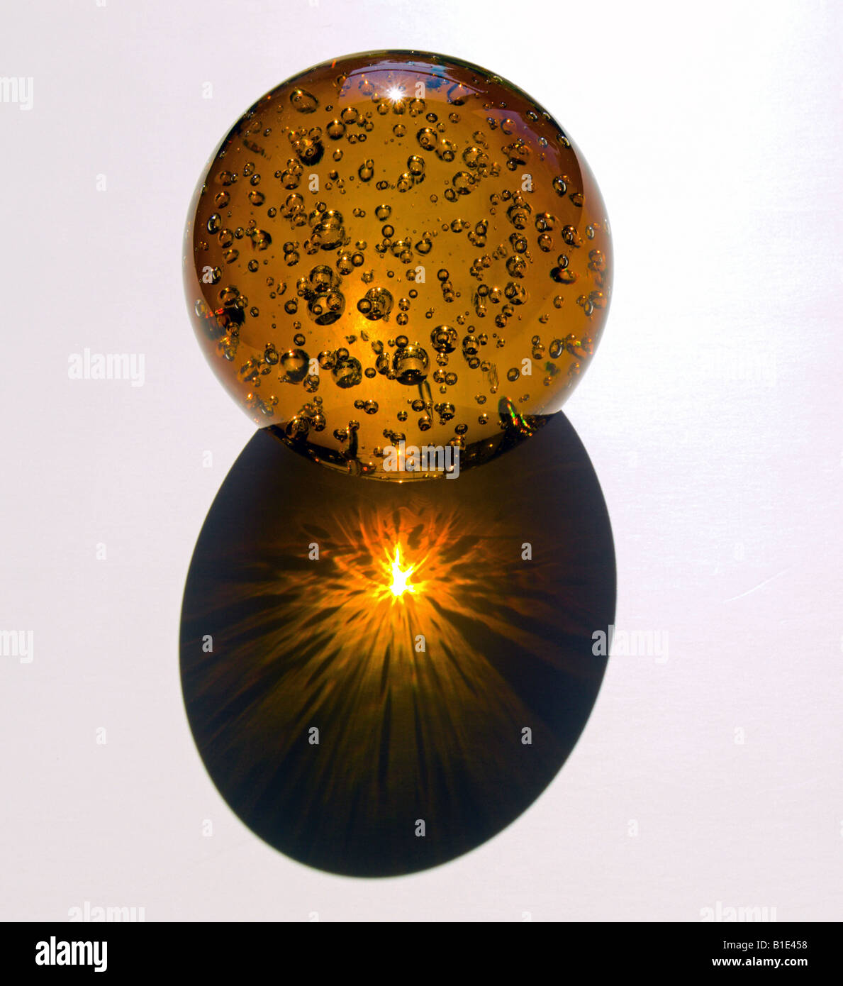 THE ENERGY OF THHE SUN IS FOCUSED THOUGH A CRYSTAL BALL Stock Photo - Alamy