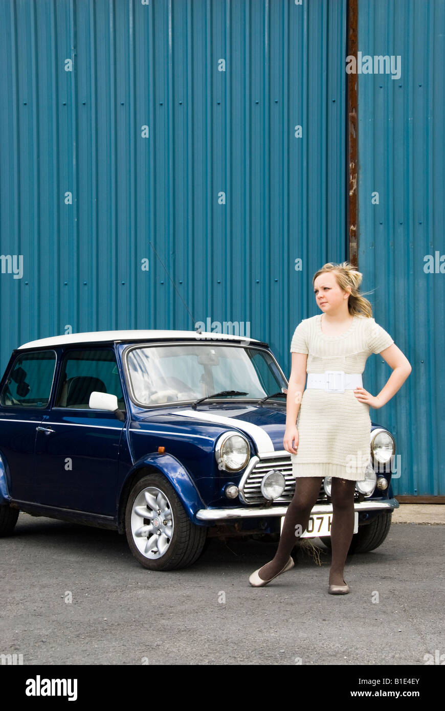 blonde female teenager waiting by parked mini cooper Stock Photo - Alamy