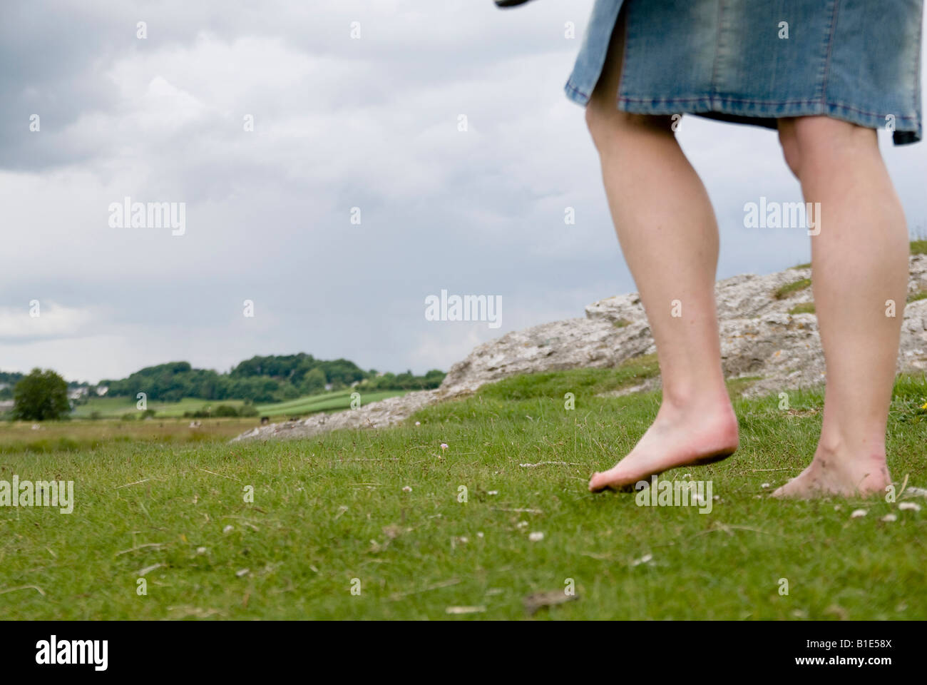 barefoot woman walking on grass Stock Photo - Alamy