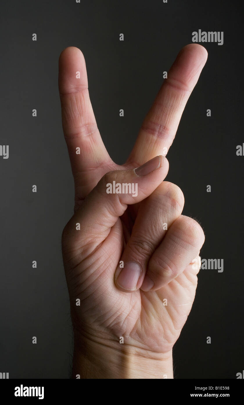 Victory hand sign Stock Photo - Alamy