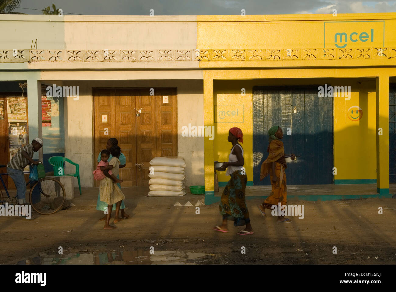 Unpaved street in the late afternoon after a rain shower near the ...