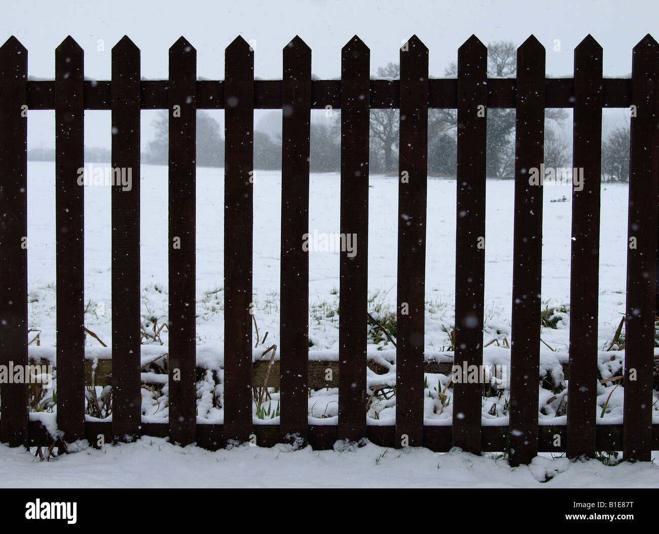 Fence in snow Stock Photo - Alamy