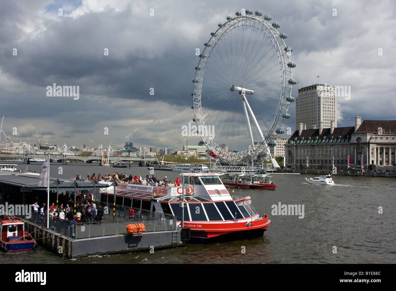 The London Eye on the Thames River in London England built to celebrate ...