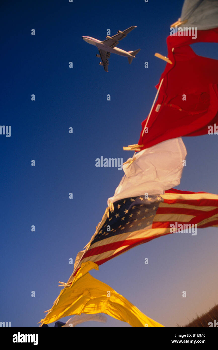 US Flag & Clothing on clothes line blowing in the wind against blue sky ...