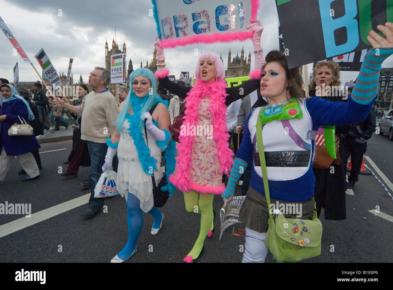 'War's a Drag' a fluffy placard carried by two men in drag in a crowd ...