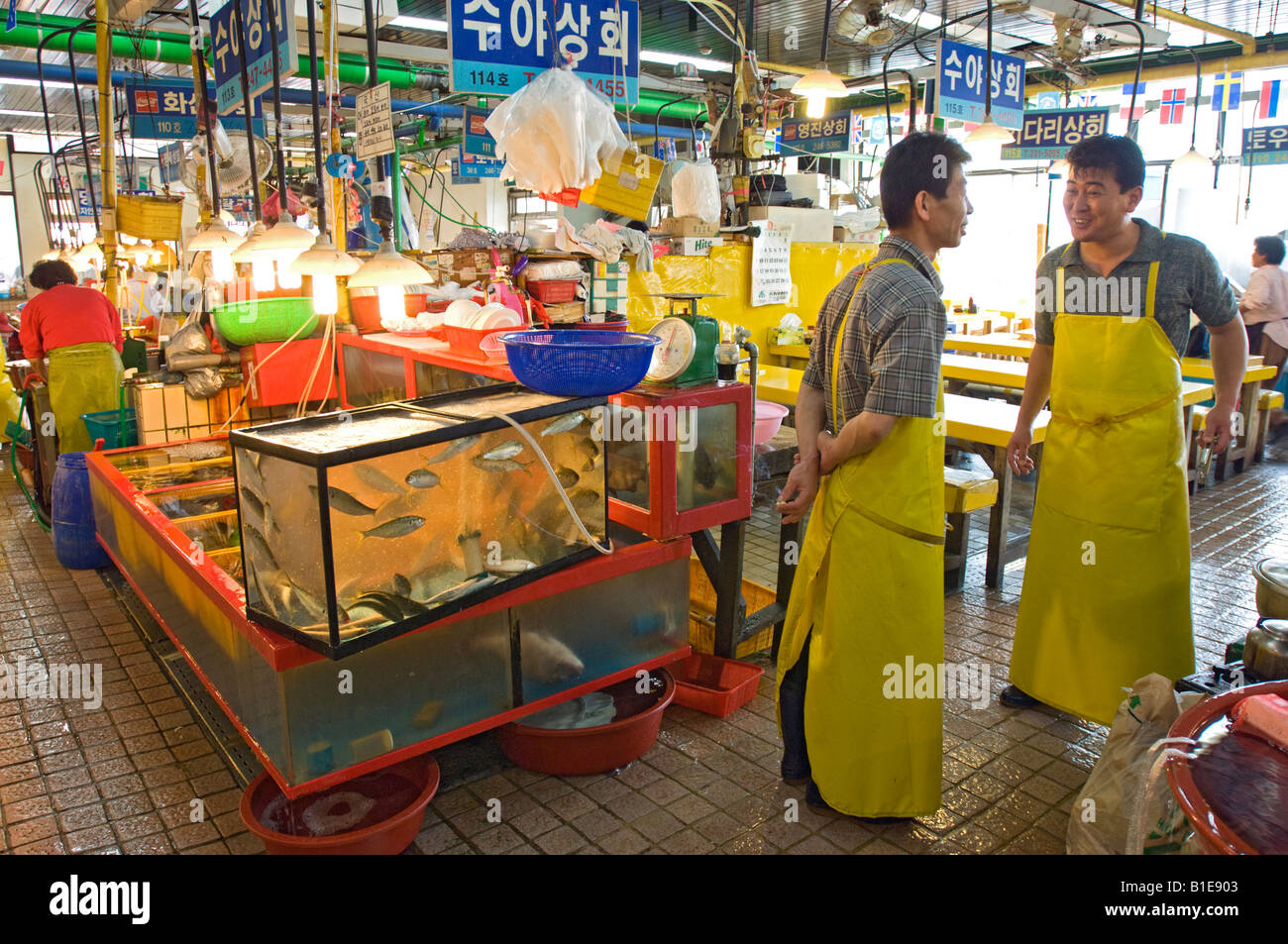 Seafood vendors in conversation at Jagalchi Fish Market, Busan, South ...