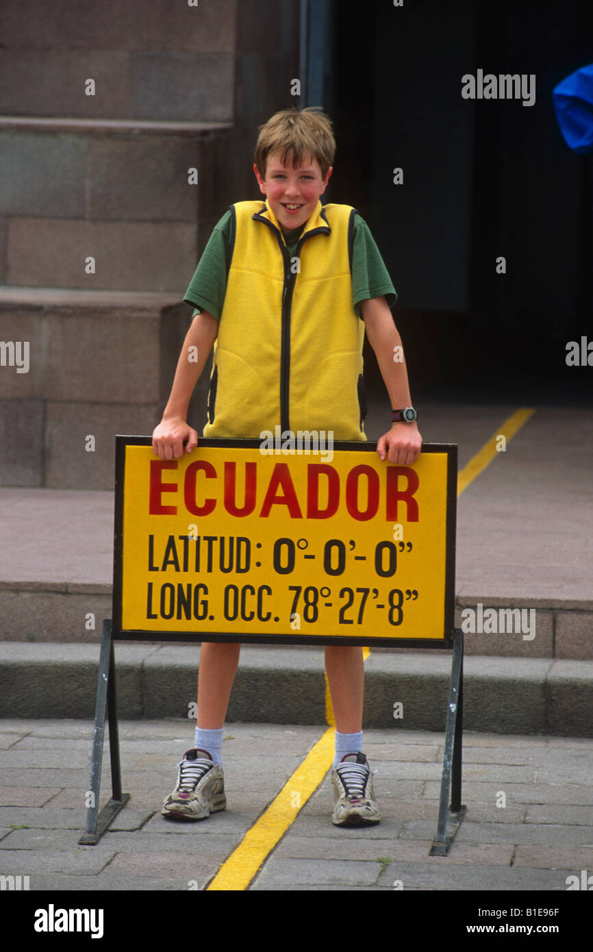 Boy standing across the equator by sign Ecuador Stock Photo - Alamy