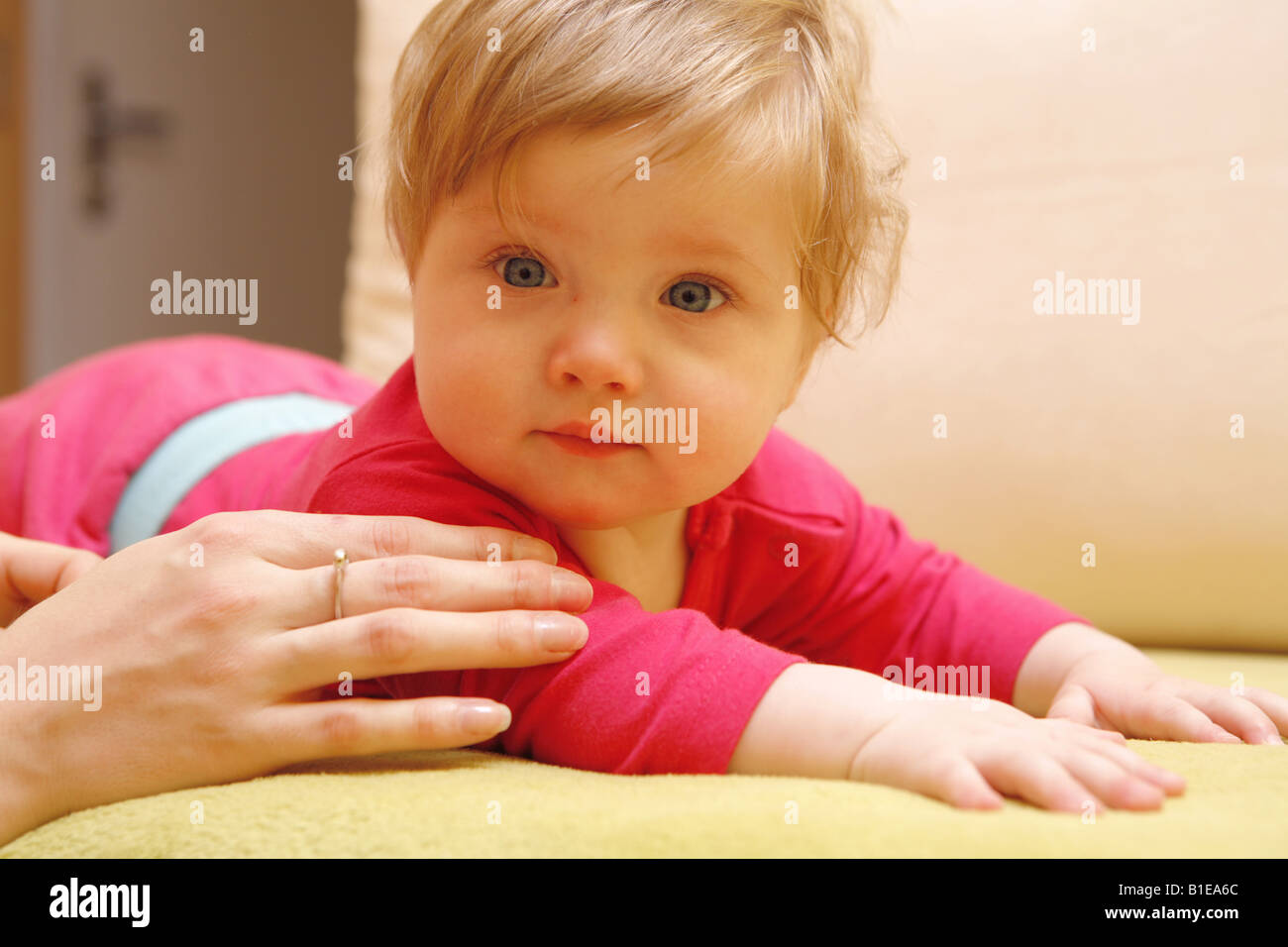 Baby toddle on bed Stock Photo - Alamy