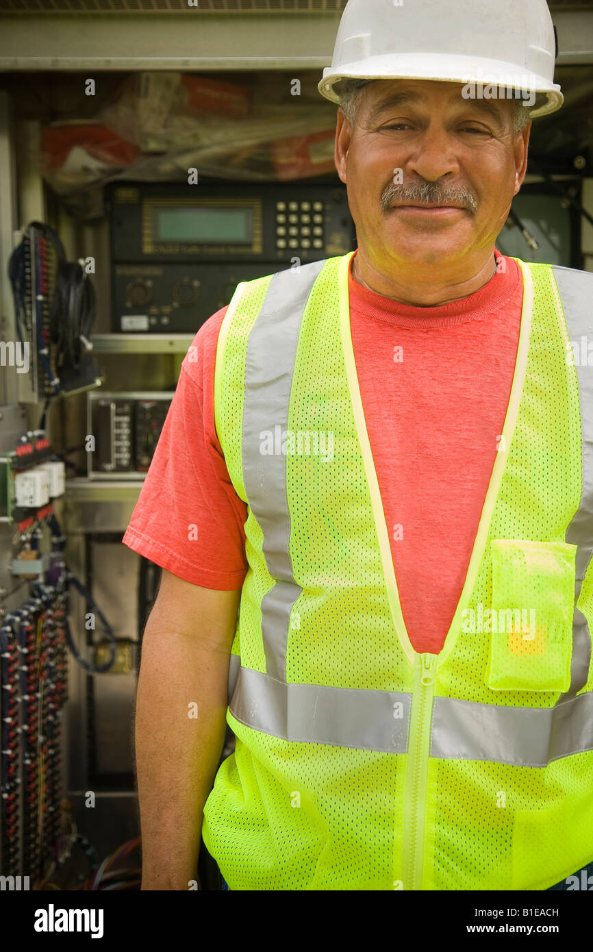 Male Hispanic construction worker smiling at the camera Stock Photo - Alamy