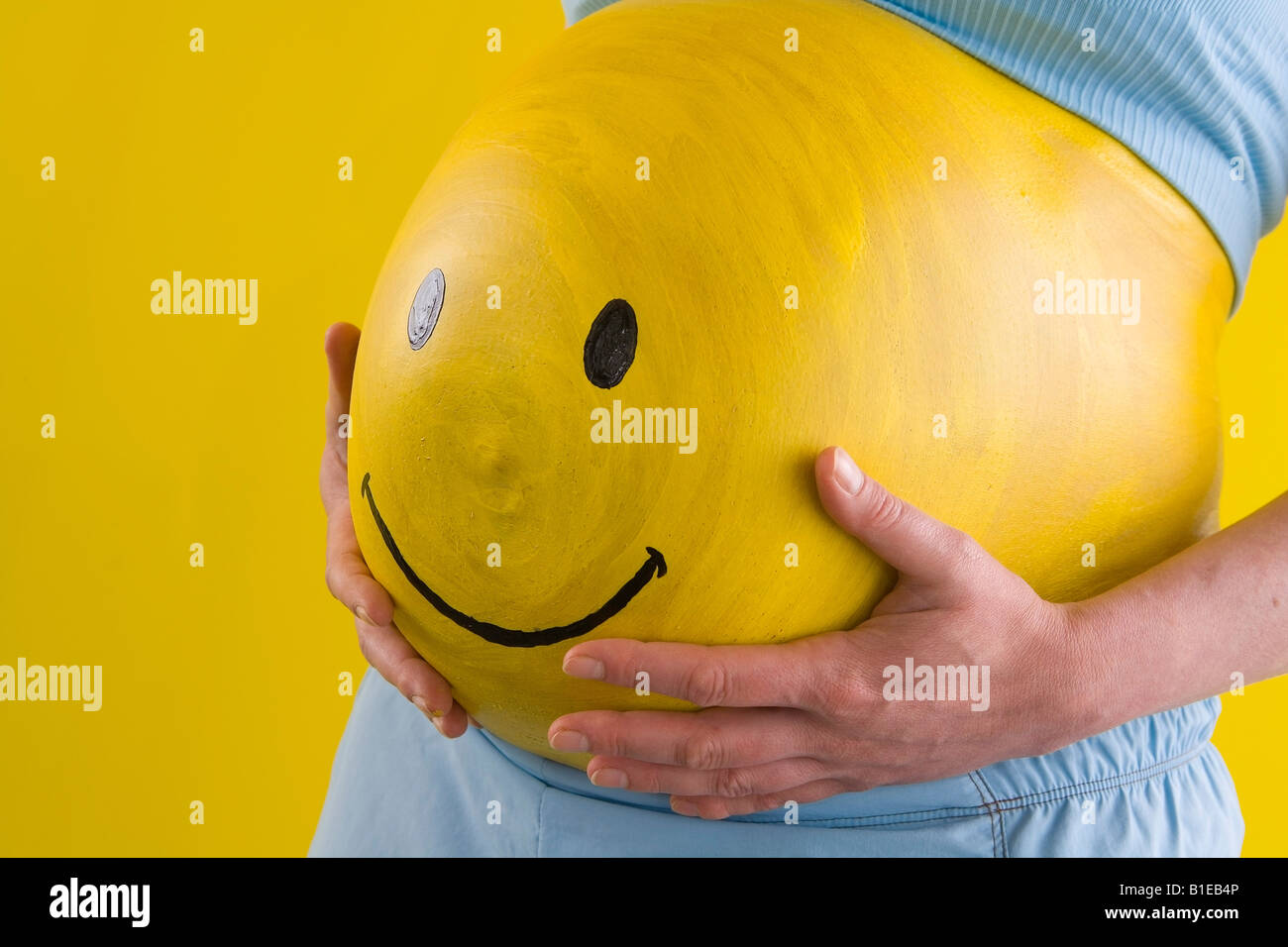 Smiley face on stomach hi-res stock photography and images - Alamy