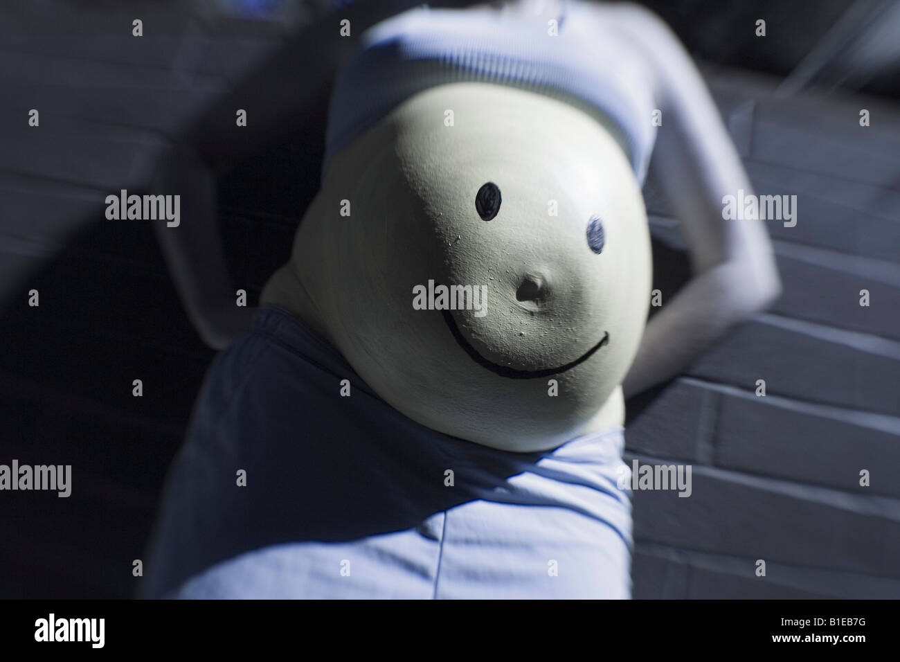 Smiley face on stomach hi-res stock photography and images - Alamy