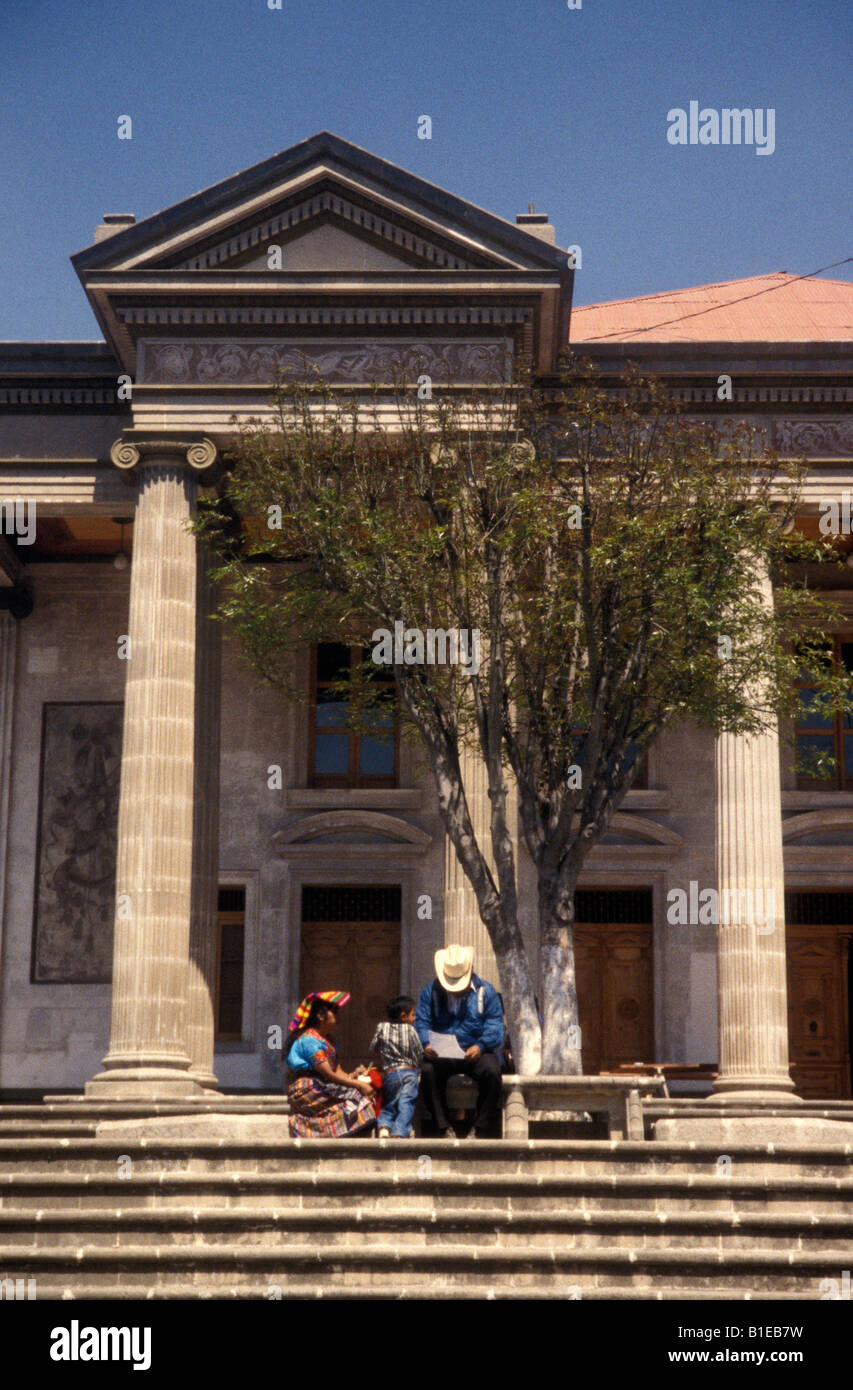 Maya family sitting on the steps of the neoclassical style Teatro ...