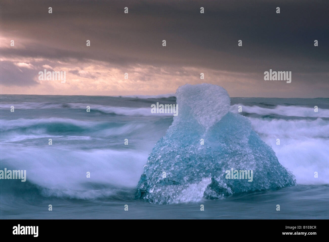 Waves crashing over iceburg Atlantic Ocean Iceland Stock Photo - Alamy