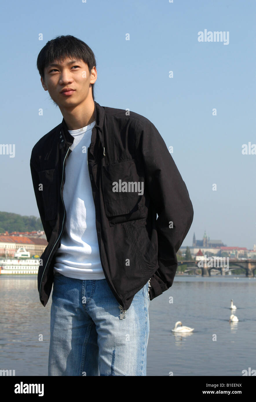 Young Asian man in a black jacket Stock Photo - Alamy