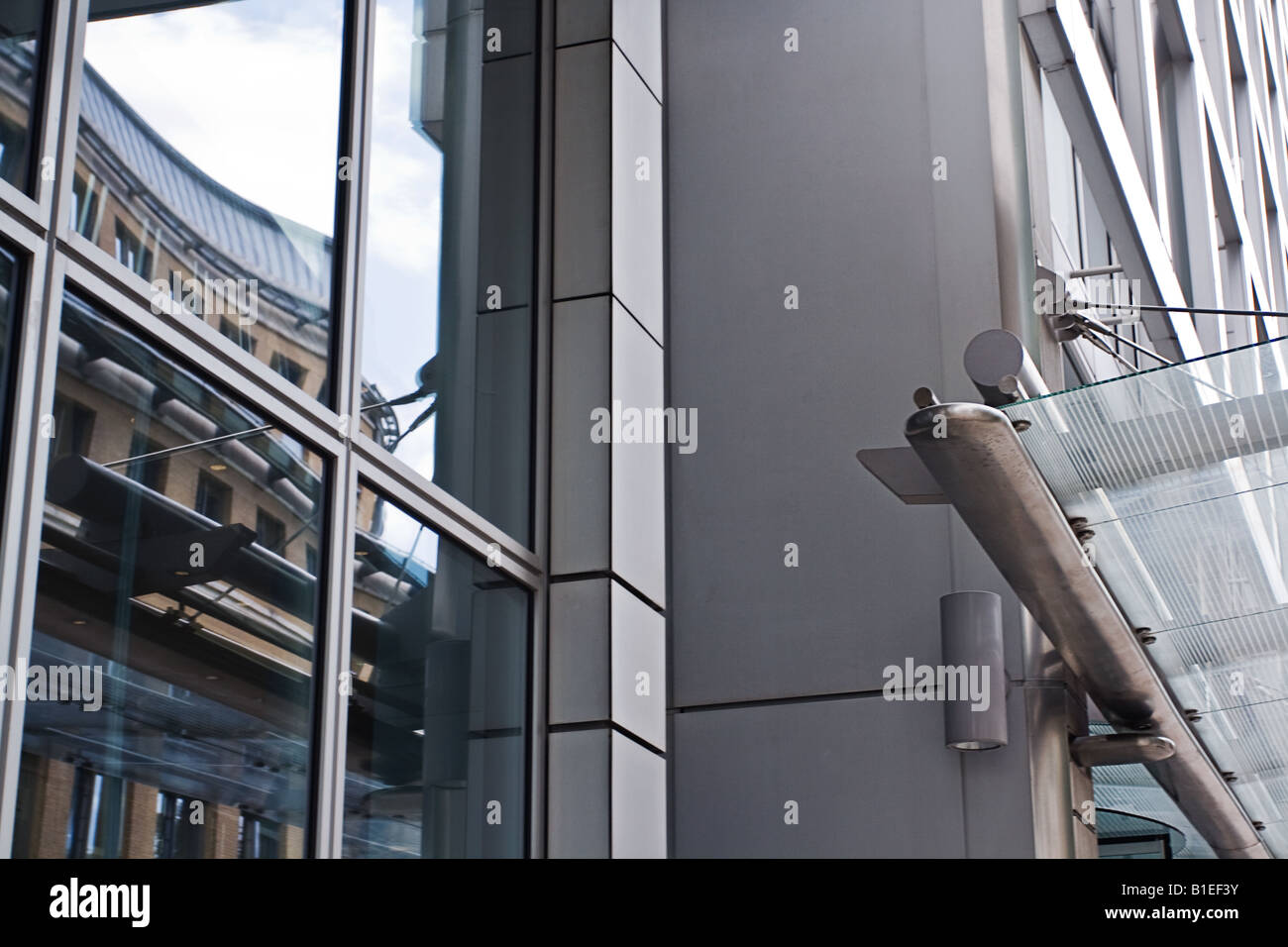 Close up of office building with reflections in glass windows Stock ...
