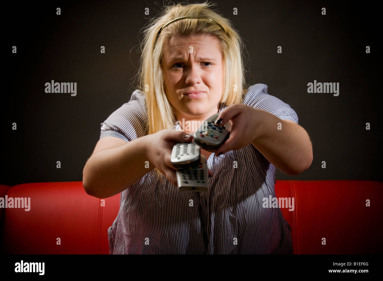 Remote control television frustrated hi-res stock photography and ...