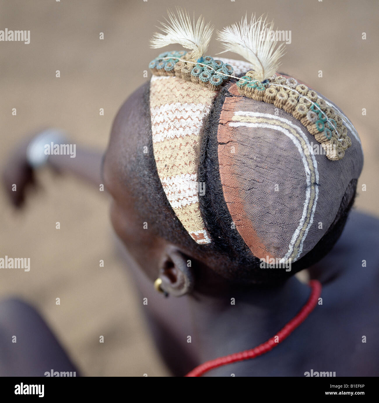 A finely decorated clay hairstyle of a Dassanech young man of the Omo ...
