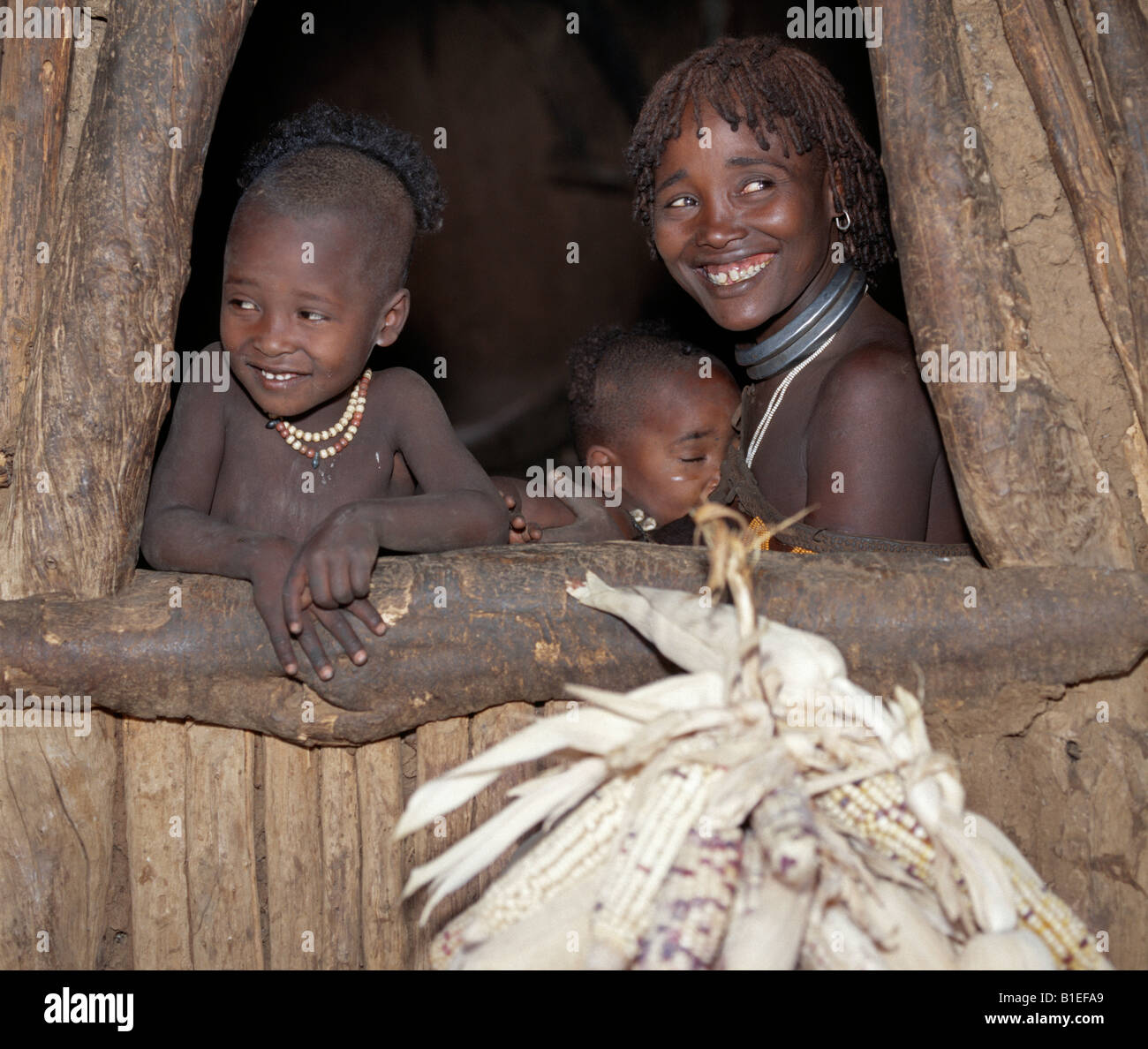A Hamar mother and her children at the entrance to their family home ...