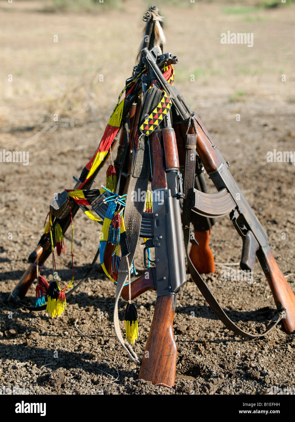 While Karo men dance, they place their automatic rifles in a stack ...