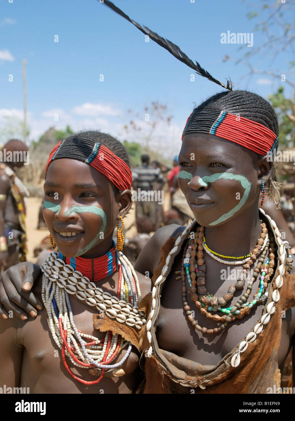 Two Hamar girl in fashionable dress at Turmi market. The Hamar are semi ...