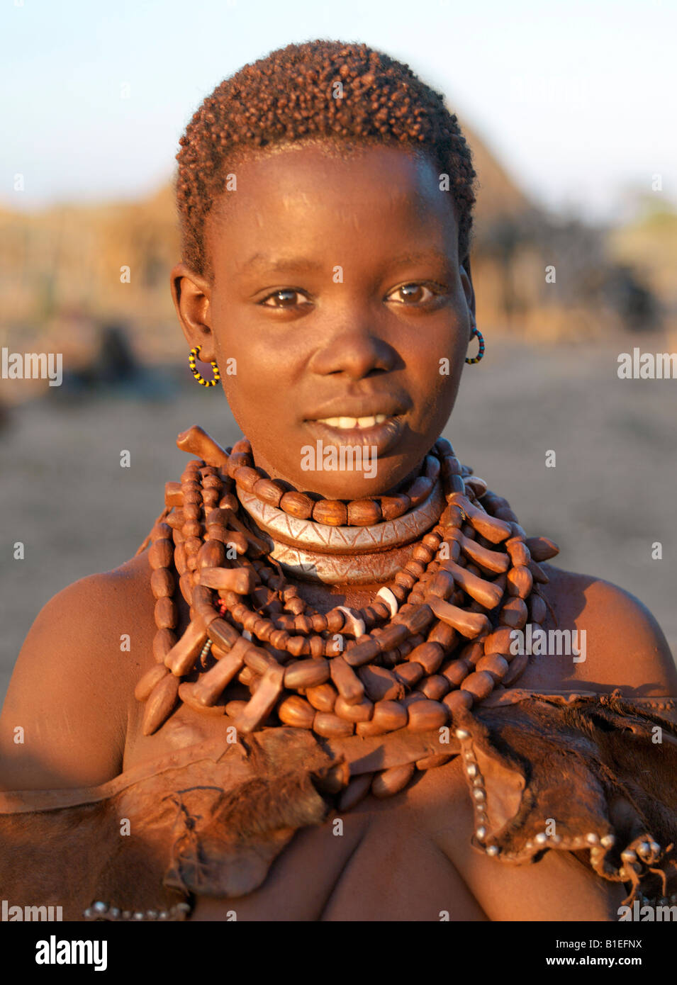 The ochre worn by a married Hamar girl glows deep red in the late ...