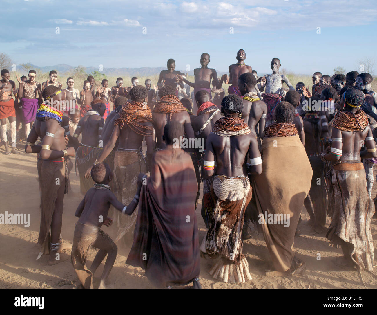 In the late afternoon, Nyag'atom villagers enjoy singing and dancing ...