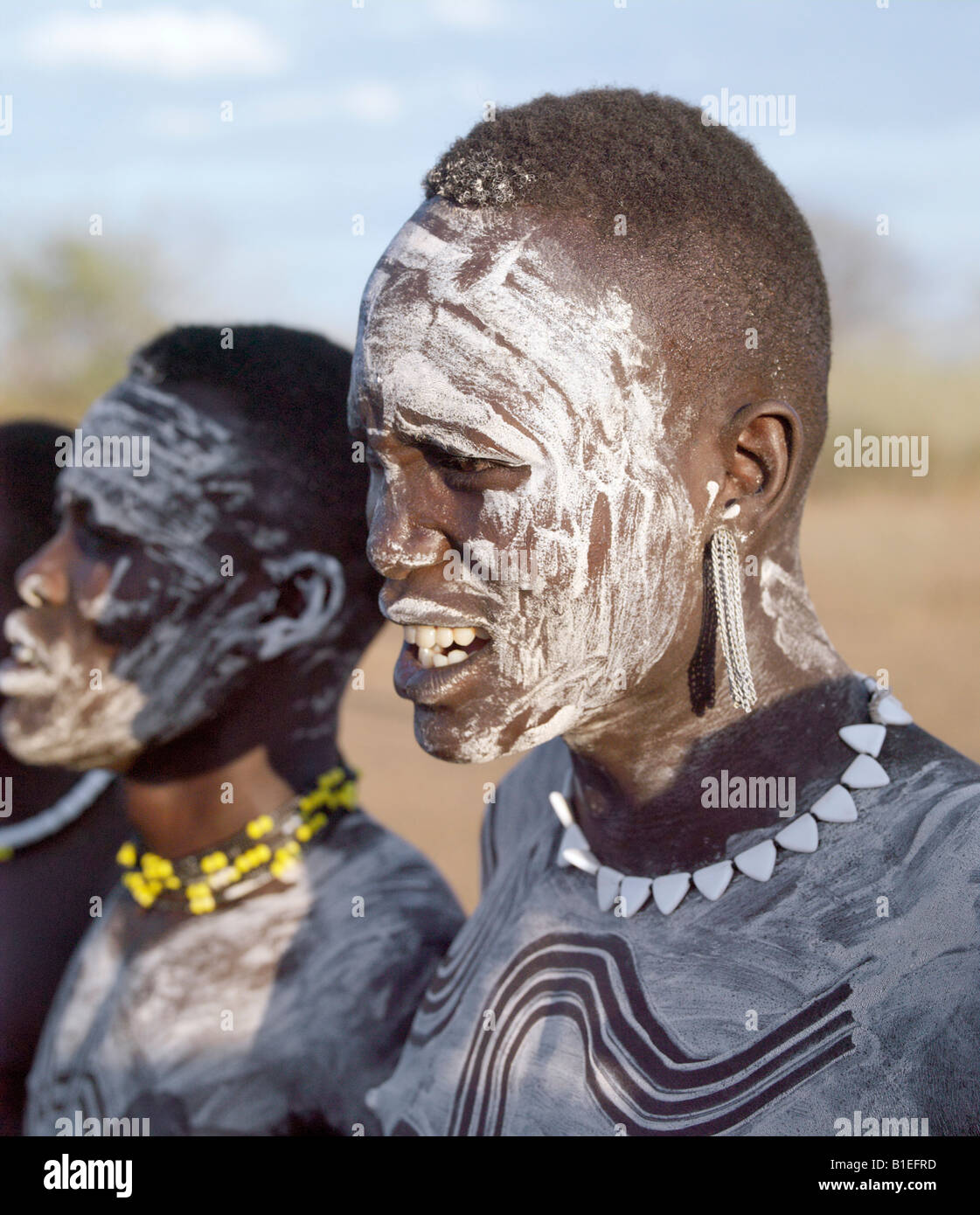 In the late afternoon, Nyag'atom men enjoy singing and dancing. The ...