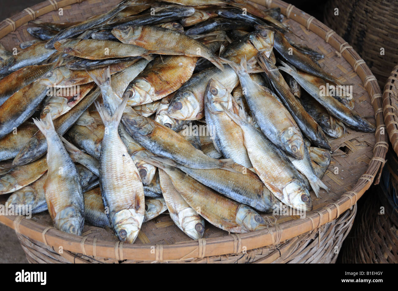 Dried fish in a traditional basket Hoi An fish market Vietnam Stock ...