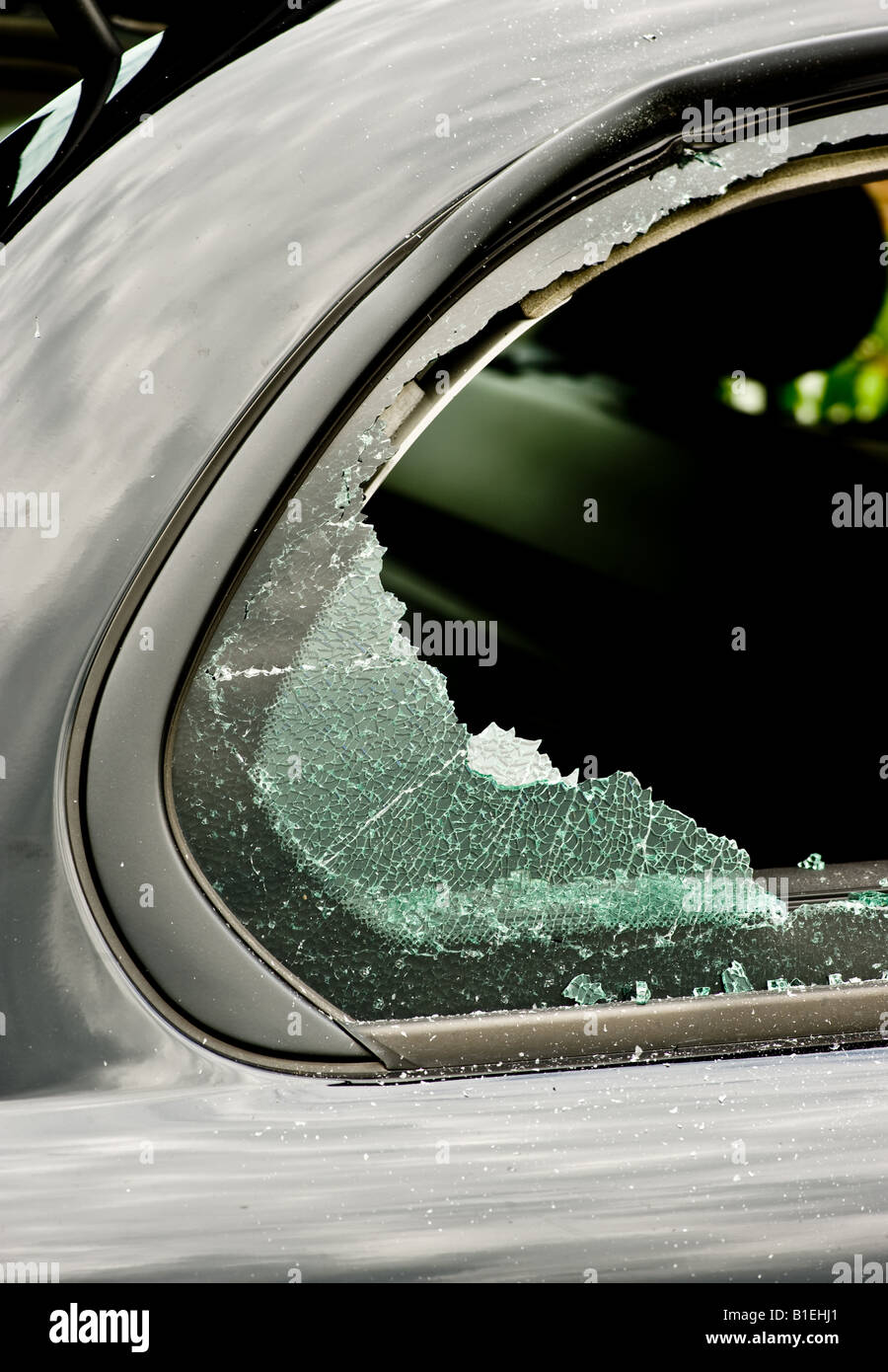 Smashed rear side window on a black car after Stock Photo - Alamy