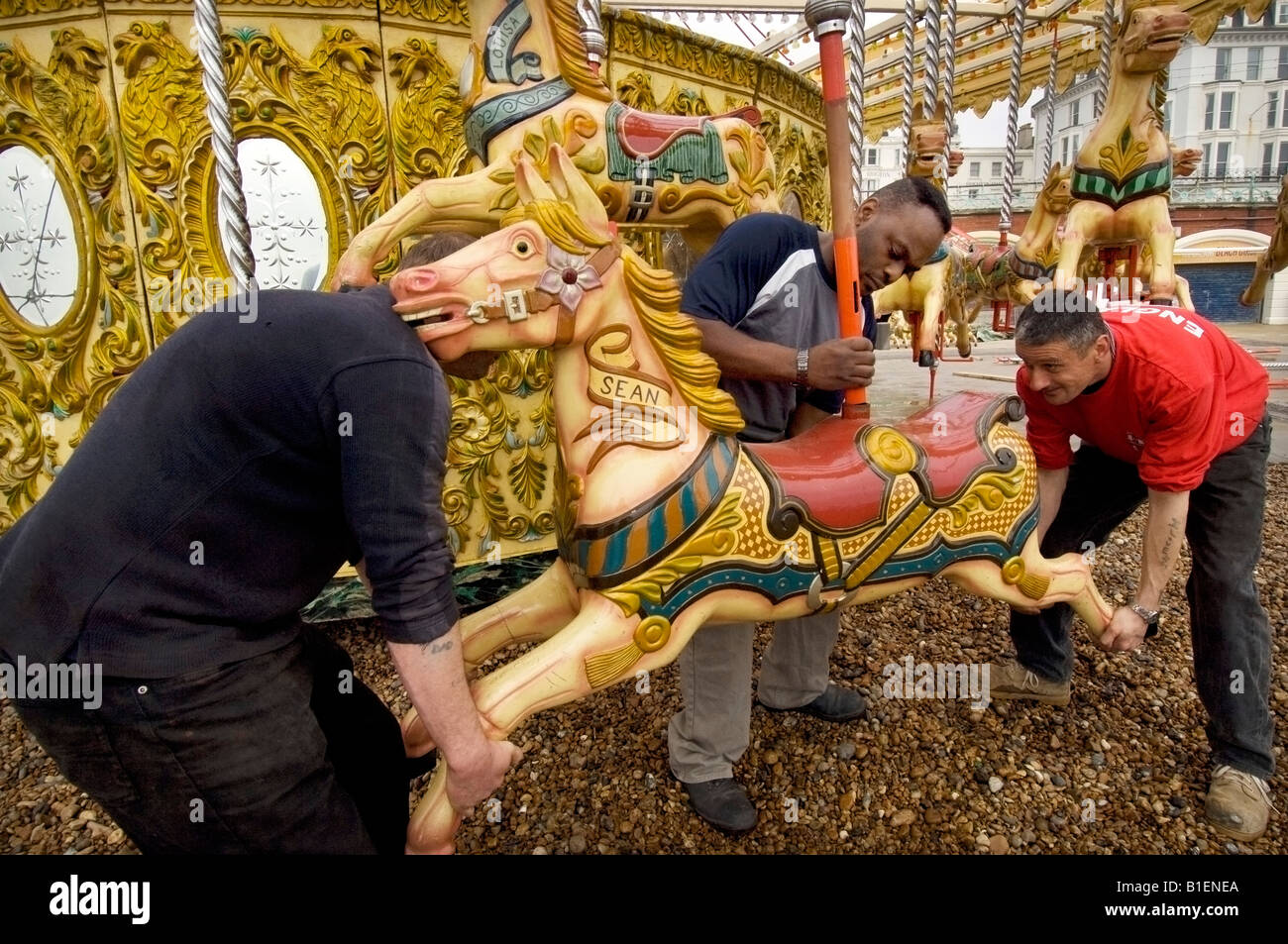 Fairground workers assemble gallopers for Owen Smith and Son's Carousel ...