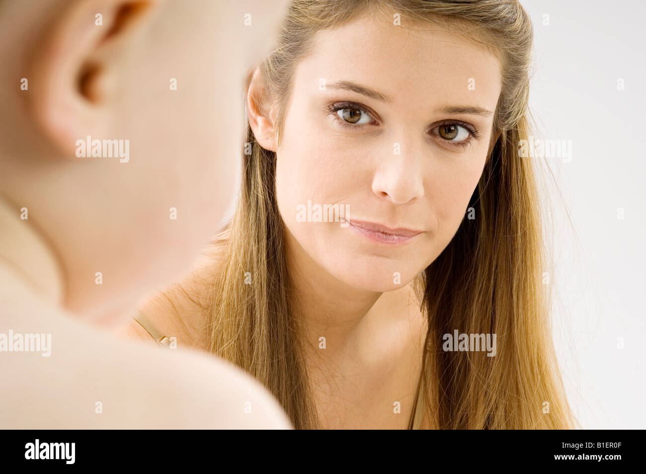 Close-up of a young woman looking at her son Stock Photo - Alamy