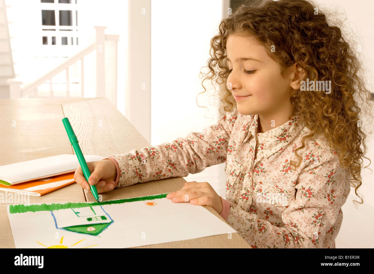 Child holding up a sheet of paper hi-res stock photography and images ...