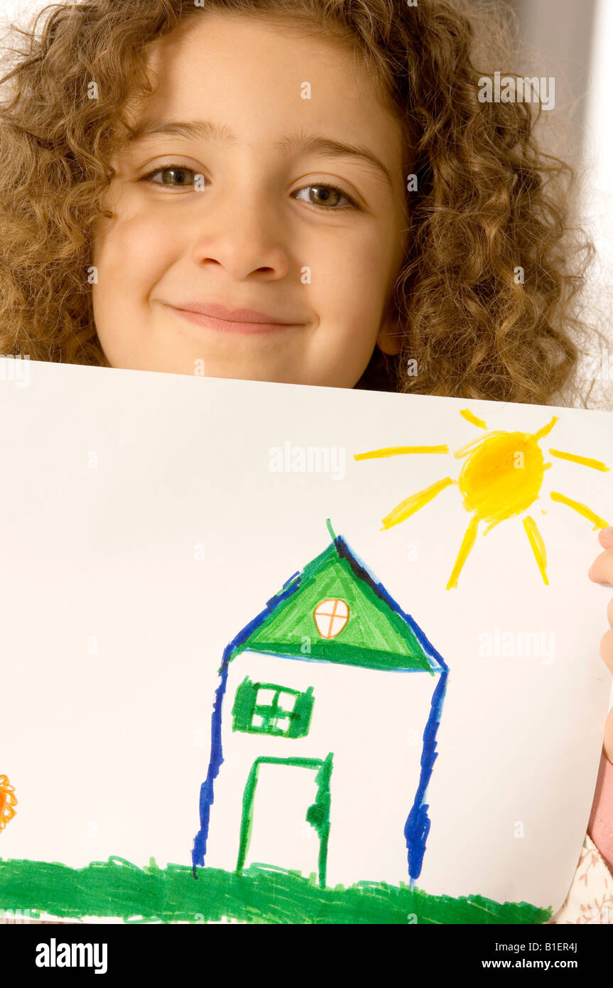 Portrait of a girl showing a drawing Stock Photo - Alamy