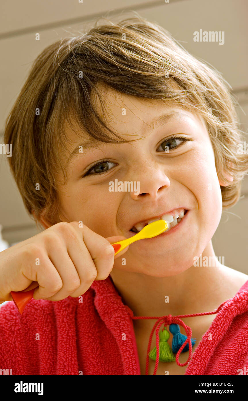 Portrait of a boy brushing his teeth Stock Photo - Alamy