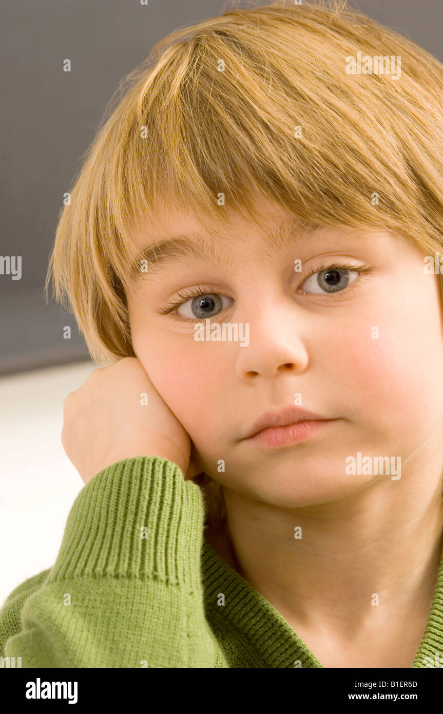 Close-up of a boy thinking Stock Photo - Alamy