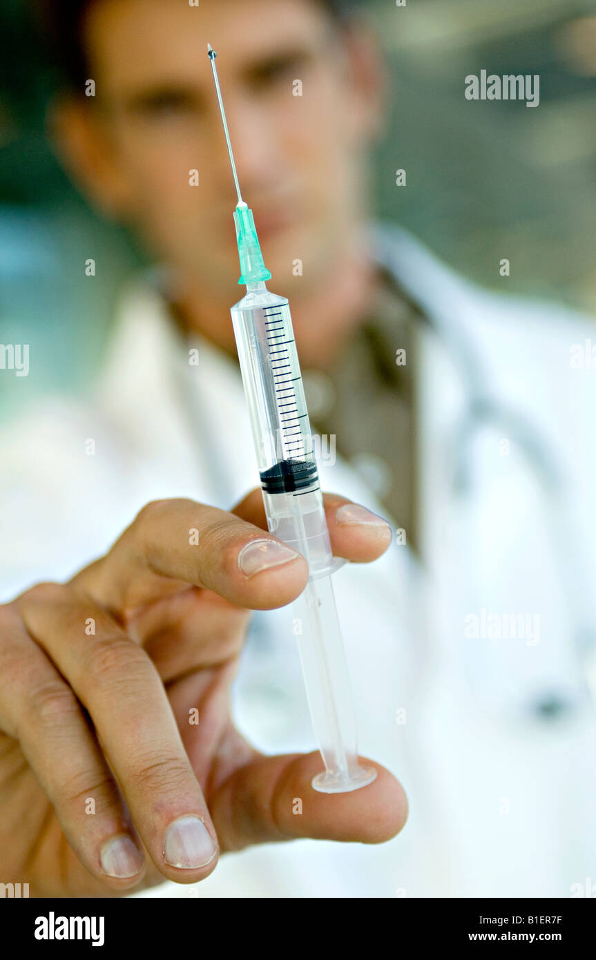 Close-up of a male doctor holding a syringe Stock Photo - Alamy
