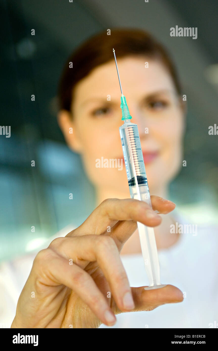 Close-up of a female doctor holding a syringe Stock Photo - Alamy