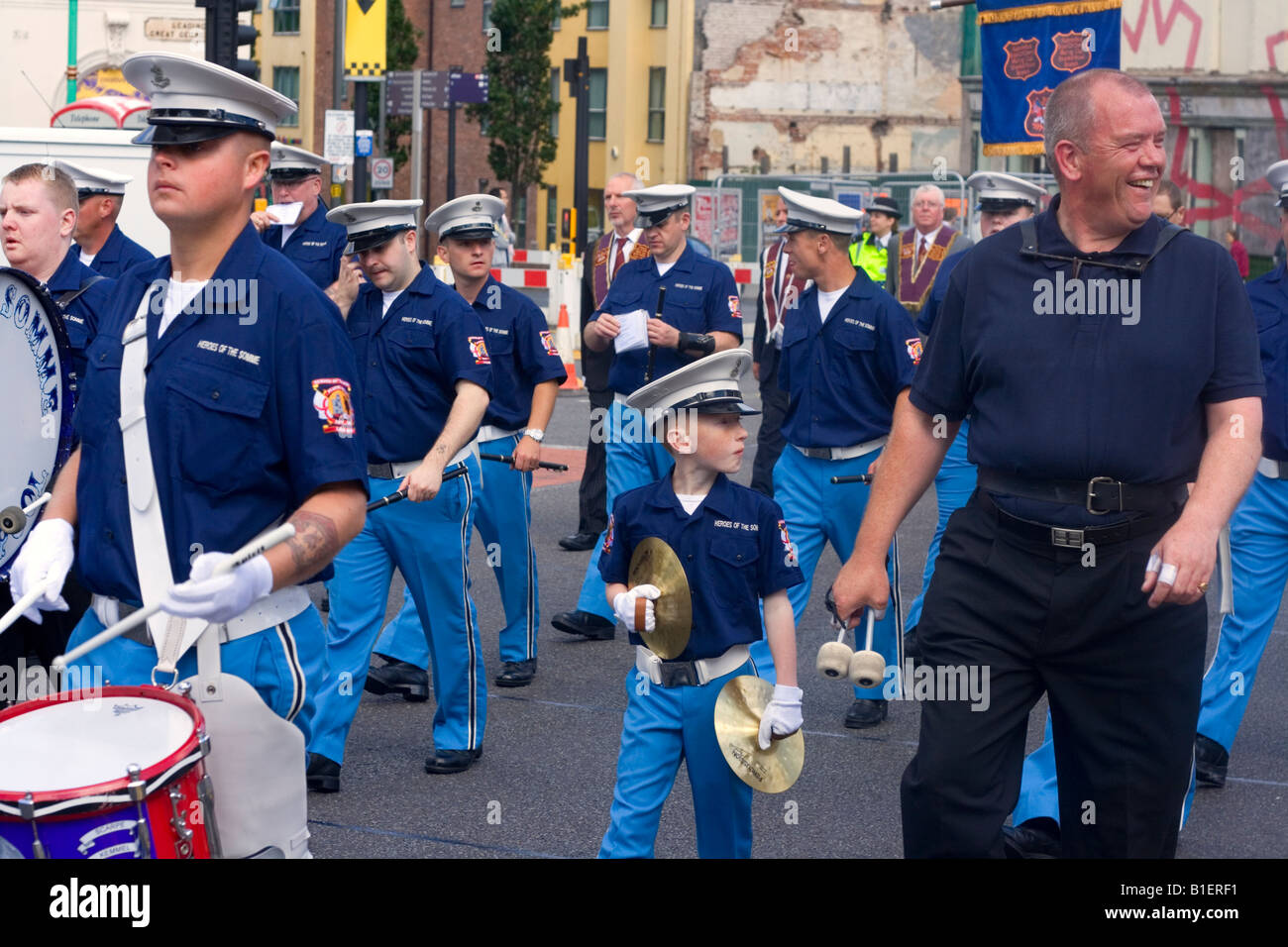 Members of the Orange Order parade through Liverpool streets in ...