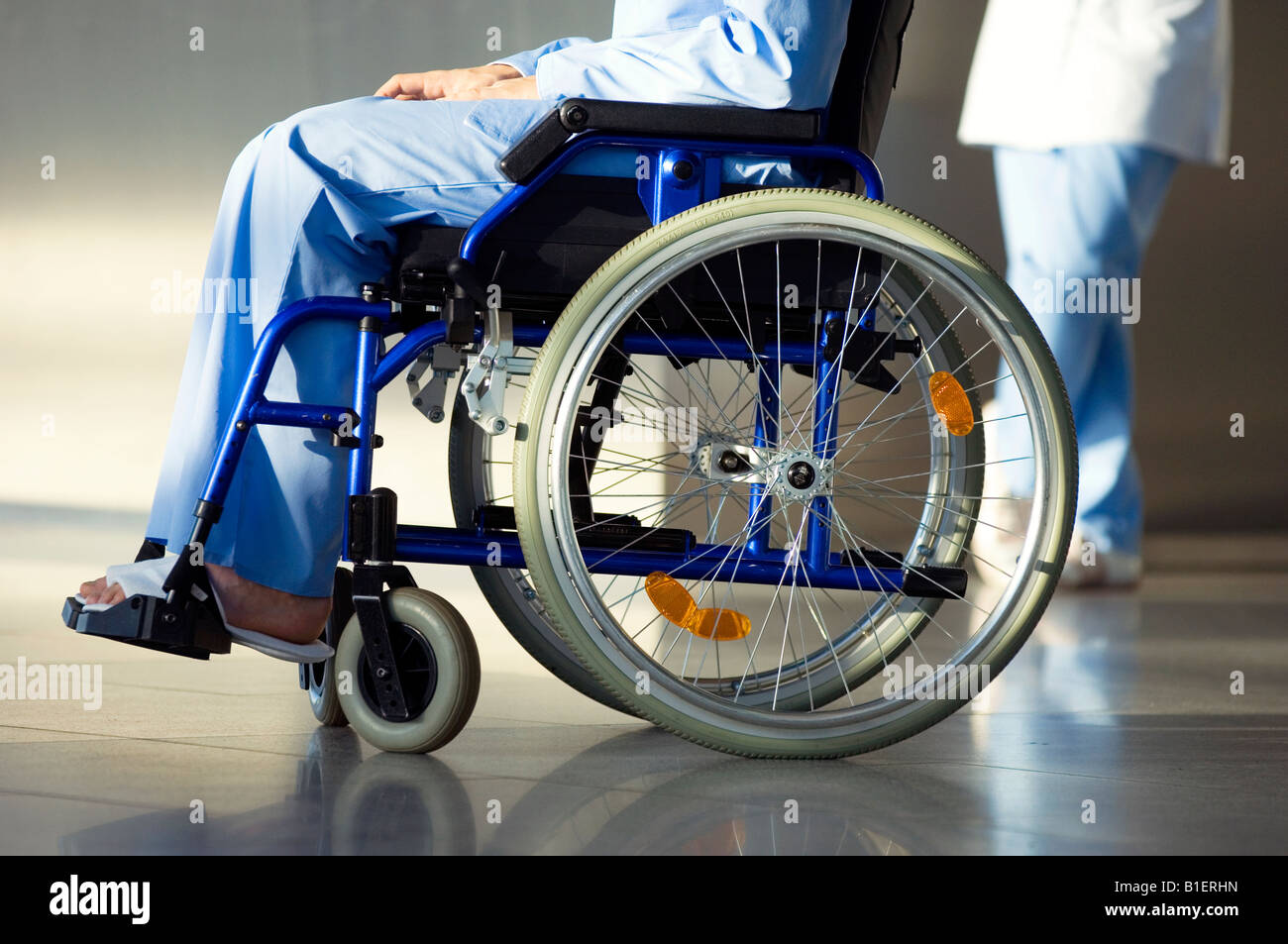 Low section view of a patient sitting in a wheelchair Stock Photo - Alamy
