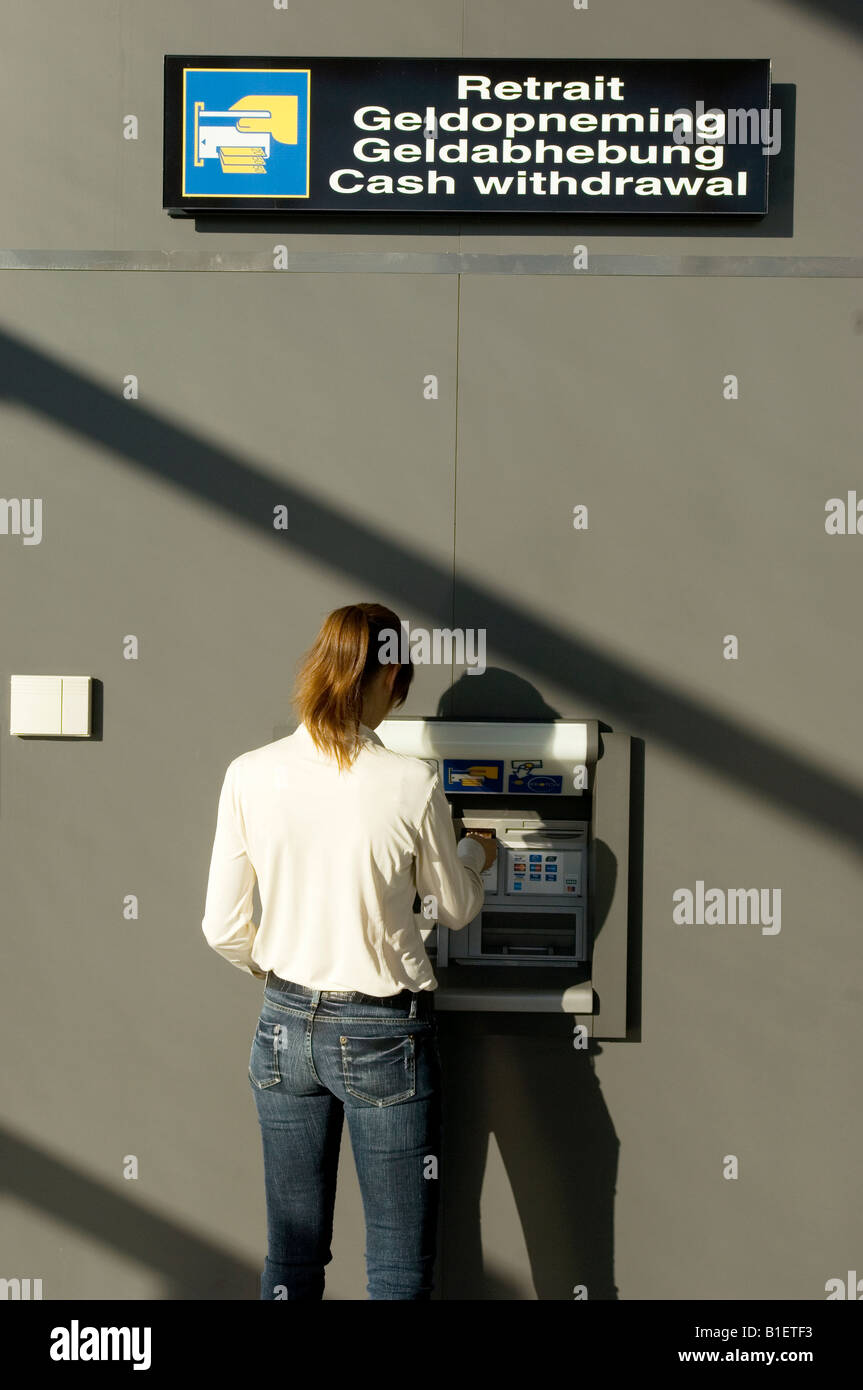 Rear view of a businesswoman using an ATM Stock Photo - Alamy