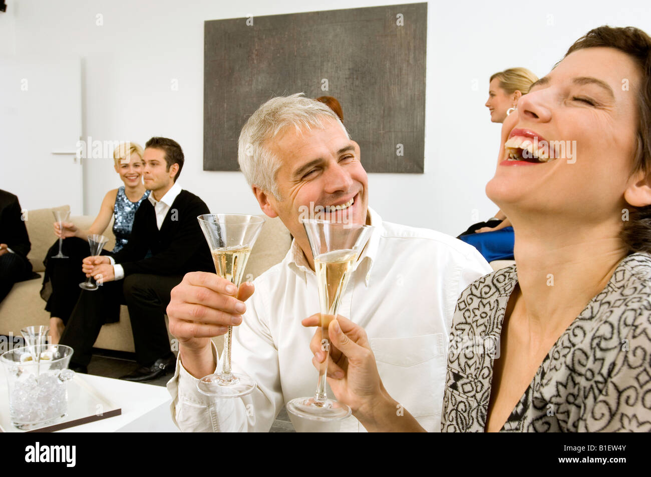 Group of people enjoying a party Stock Photo - Alamy