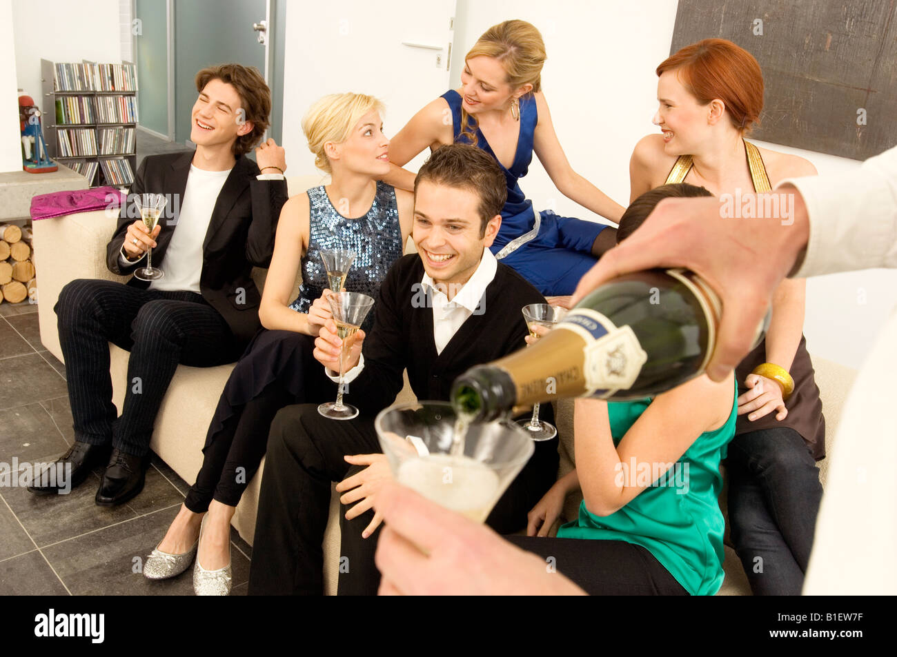 Group of people enjoying a party Stock Photo - Alamy