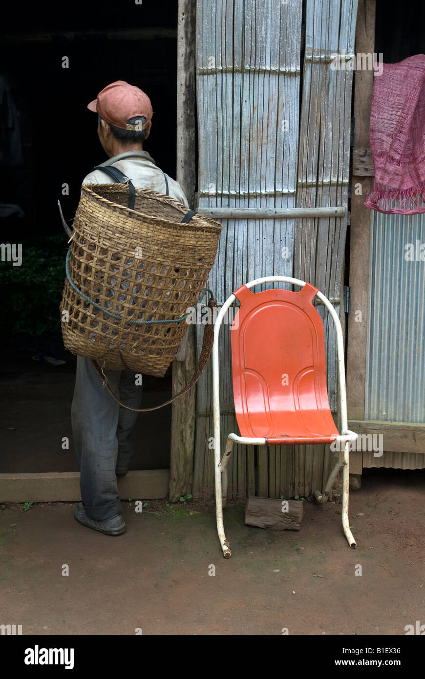 Lahu hill tribe man with a basket used for harvesting tea or coffee ...