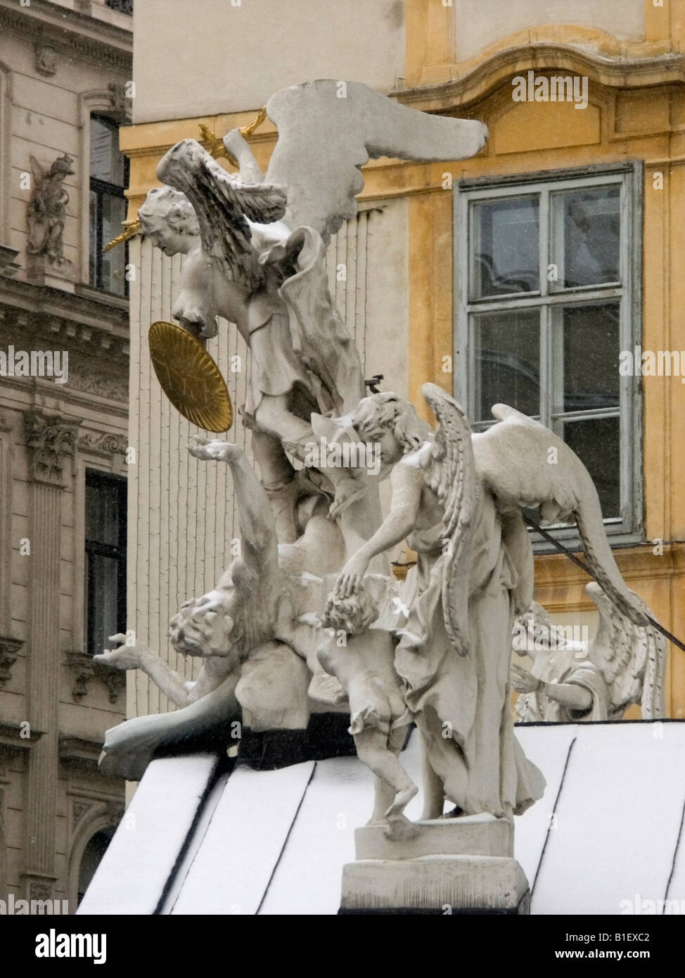 Snow on statue group of Archangel Michael defeating evil on the top of ...