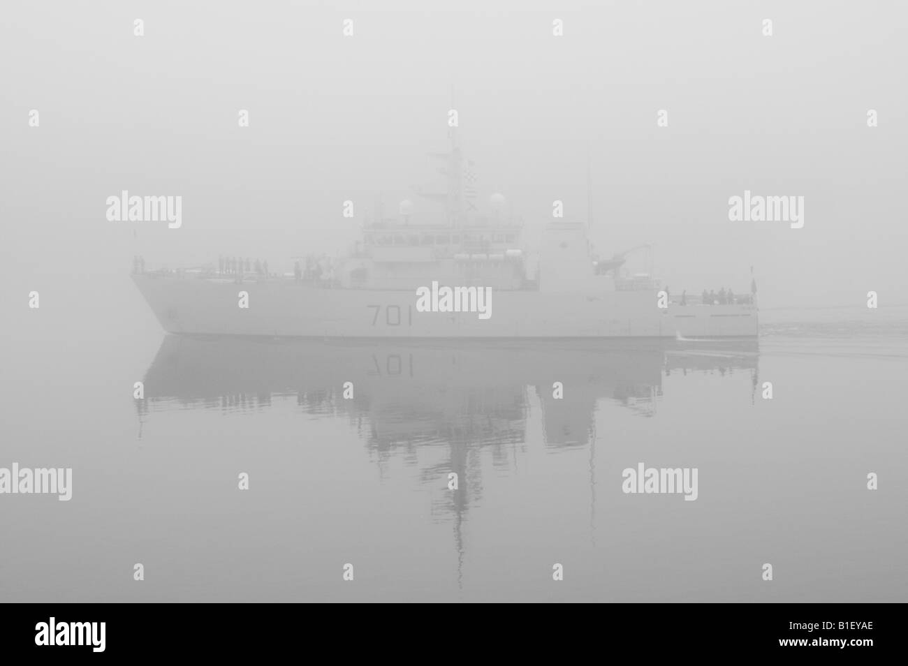 The minesweeper HMCS GLACE BAY transits Halifax Harbour in the fog ...