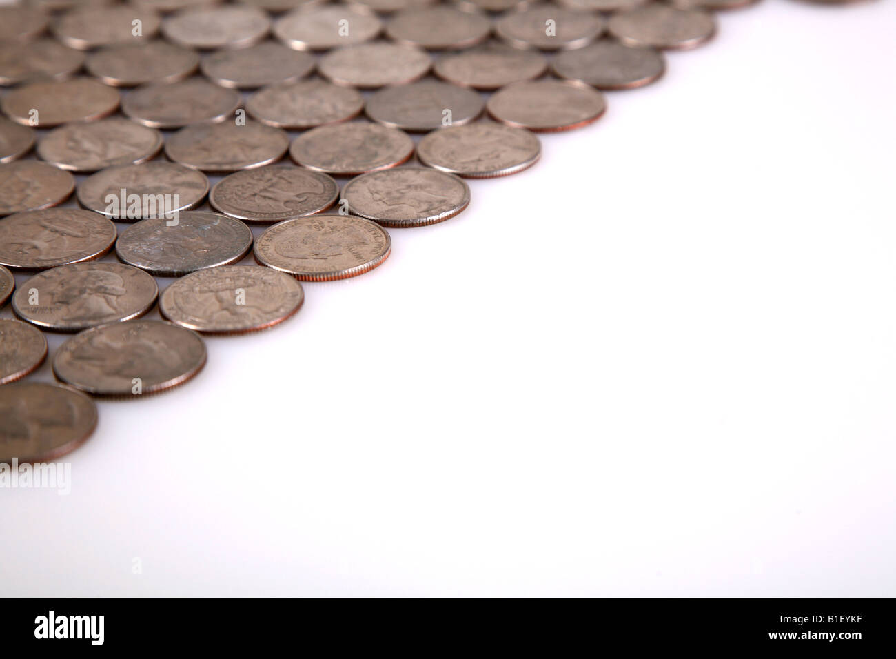 American quarter dollar coins arranged in a triangular formation group ...